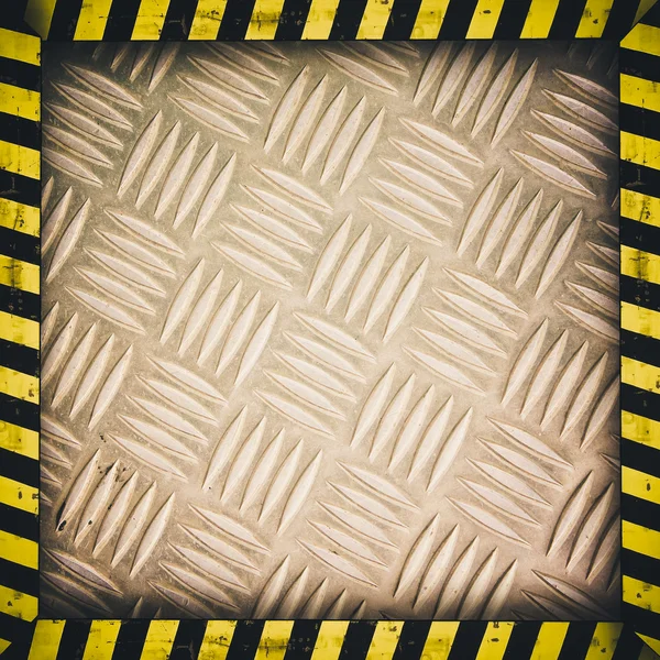 Metal background with warning stripe Stock Photo by ©roobcio 33239301