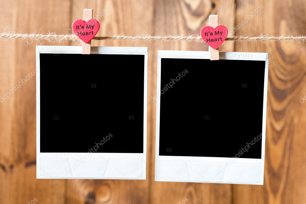 Old picture frame hanging on clothesline — Stock Photo © roobcio #45825065