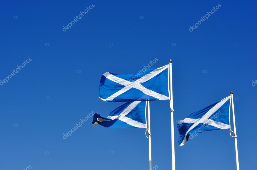 Three Scottish or saltire flags blowing in the wind — Stock Photo ...
