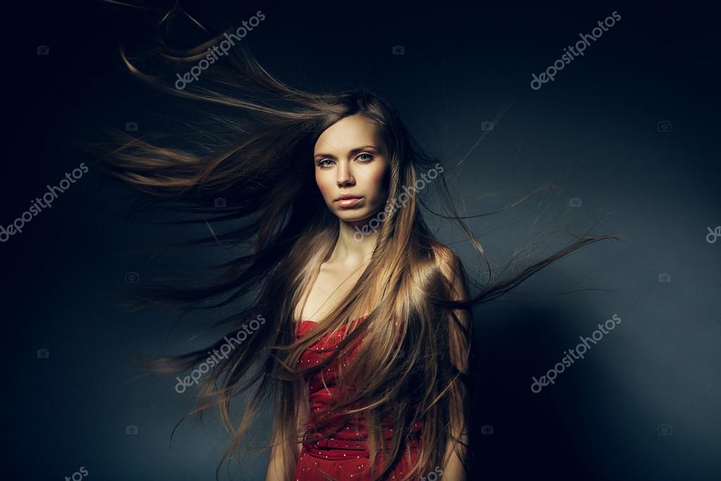 Pretty woman with long windy hair — Stock Photo © alexannabuts #14301219