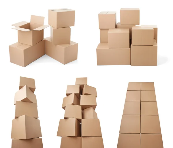 Stacks of cardboard boxes isolated on white background — Stock Photo © photkas #22869726
