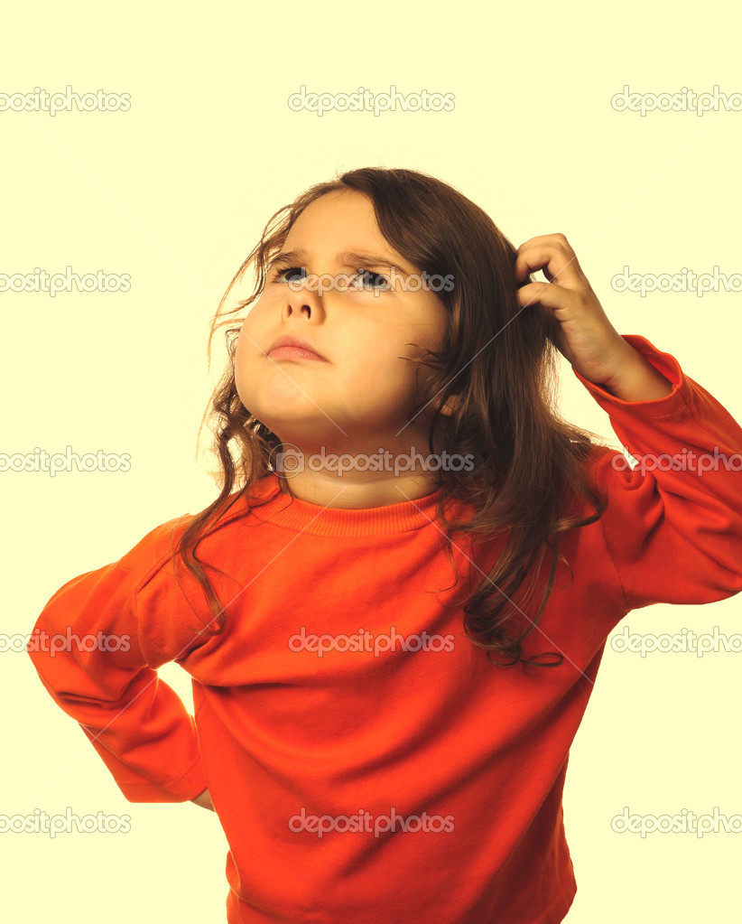 Angry evil child curly girl in orange sweater angry isolated on Stock ...