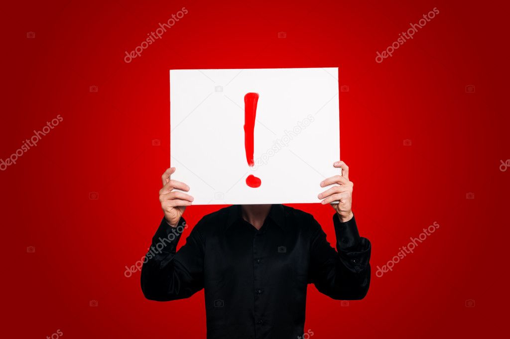 Man holding sign exclamation mark — Stock Photo © peus #13603115