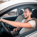 Stylish man driving car Stock Photo by ©peus 27865179