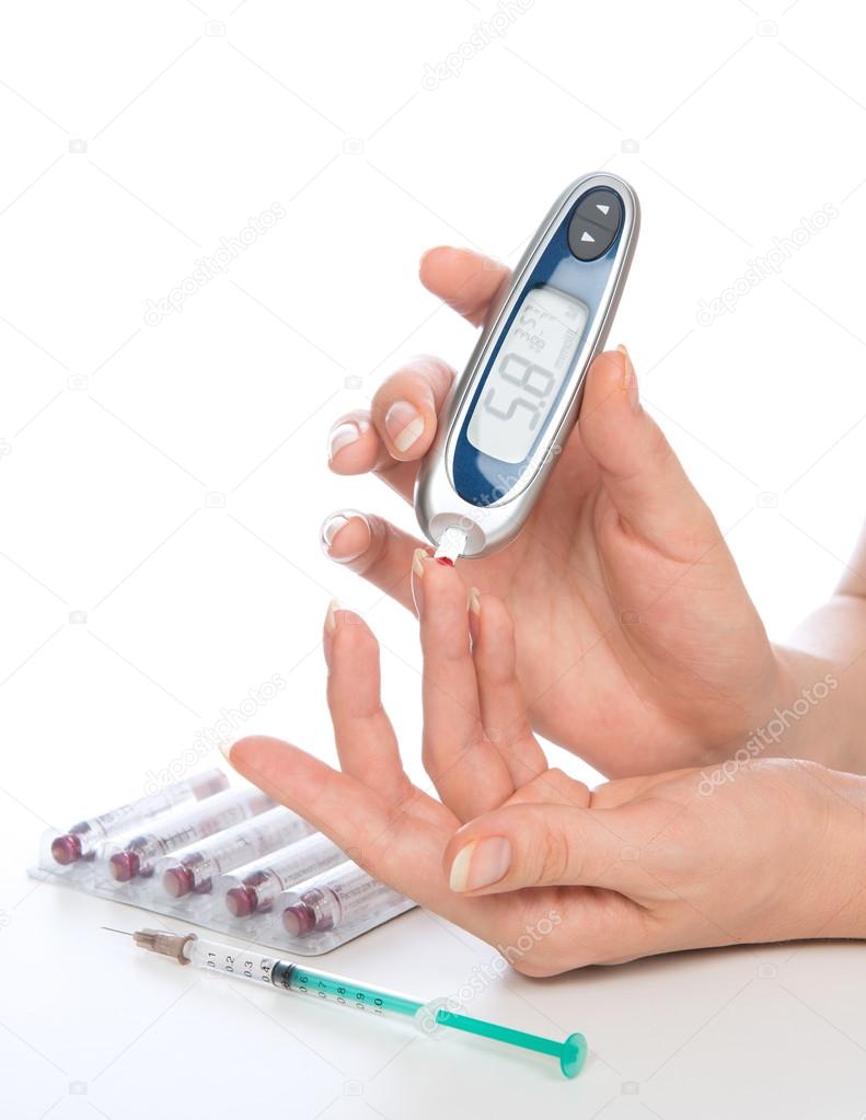Measuring glucose level blood test with glucometer Stock Photo by ...