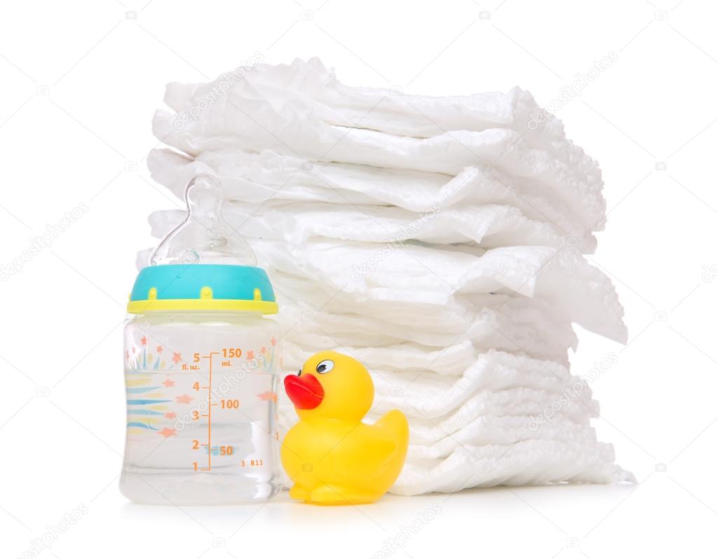 Child stack of diapers bottle with water duck — Stock Photo © dml5050 ...