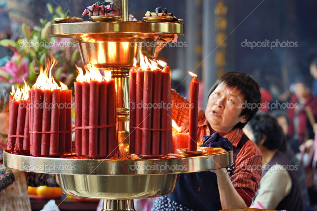 Buddhist Temple Candles — Stock Editorial Photo © sepavone #28949439