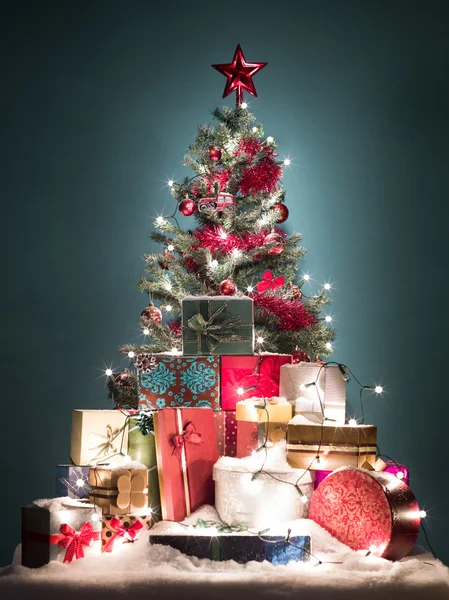 Brightly lit christmas tree with presents — Stock Photo © shotsstudio ...
