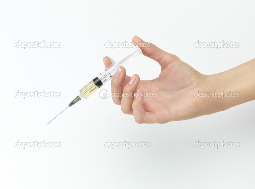 Hand with syringe Stock Photo by ©shotsstudio 17591977