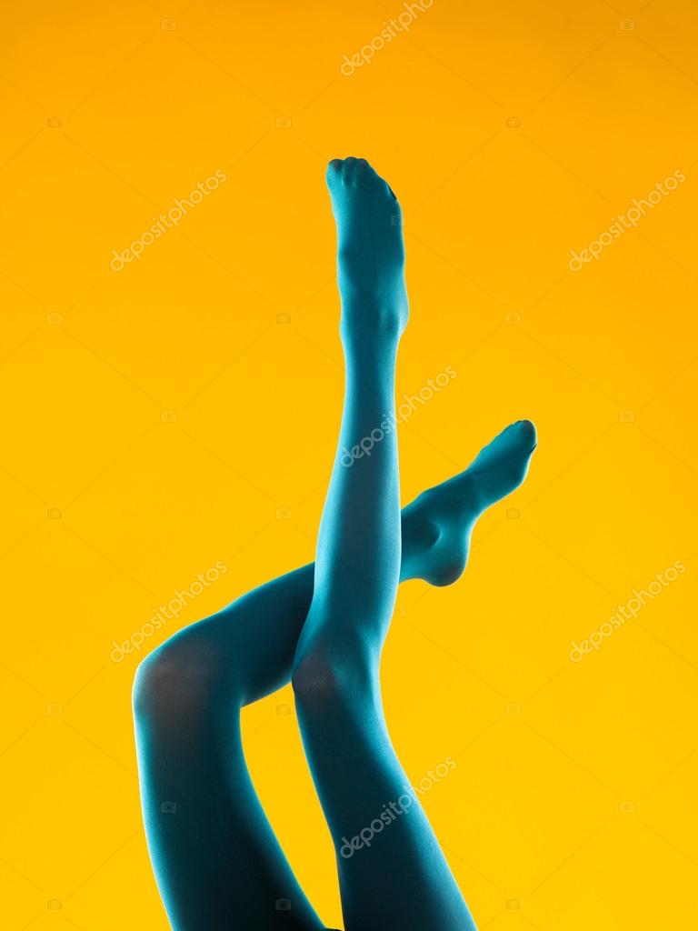 Female legs in blue stockings — Stock Photo © shotsstudio #32635065