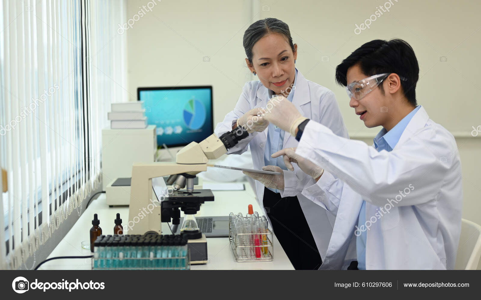 Professional Scientists Team Conducting Experiments Consisting