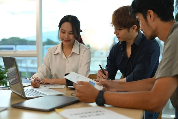 Image of successful start up business team sharing ideas, discussing ...