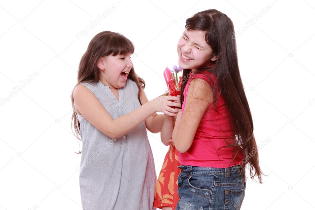 Girls holding spring flower in pot — Stock Photo © Mari1Photo #42623803
