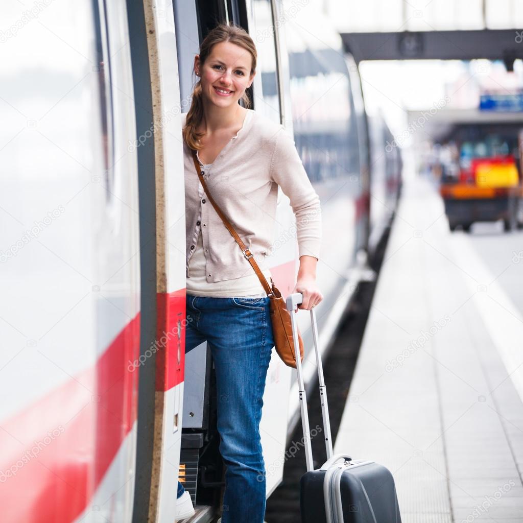 Pretty young woman boarding a train — Stock Photo © lightpoet #17128593