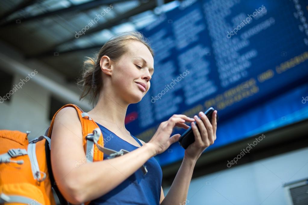 Woman in a train station, sending message Stock Photo by ©lightpoet ...