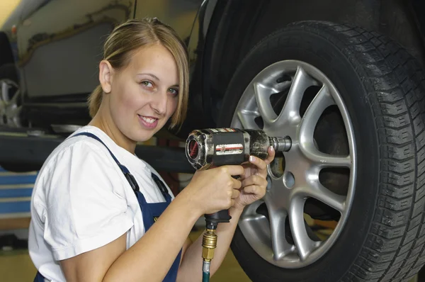 Changing wheels in car workshop - Stock Image - Everypixel