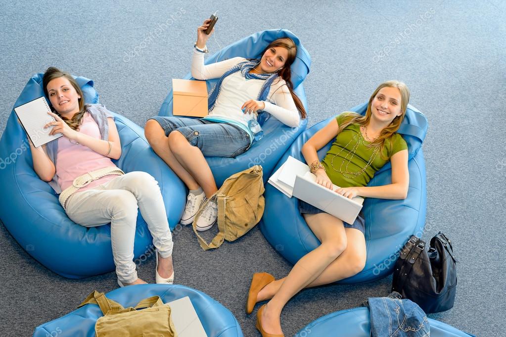 Group of students relax on beanbag — Stock Photo © CandyBoxImages #12588929