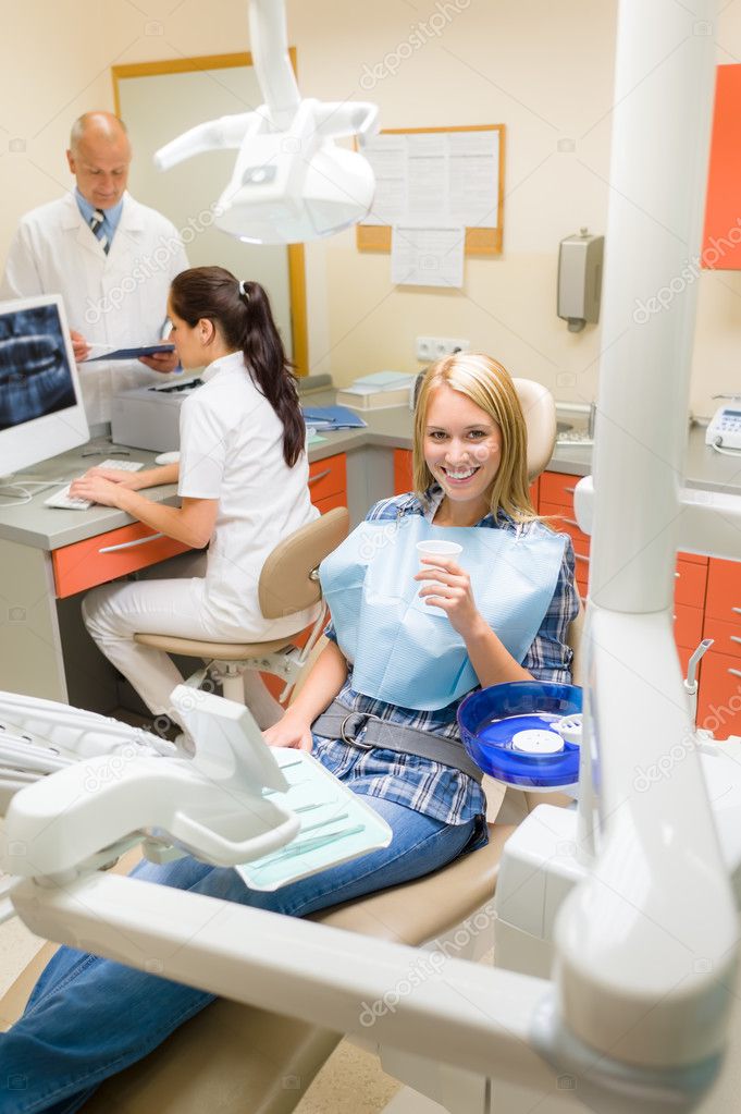 Happy patient woman at dental surgery — Stock Photo © CandyBoxImages #13597849