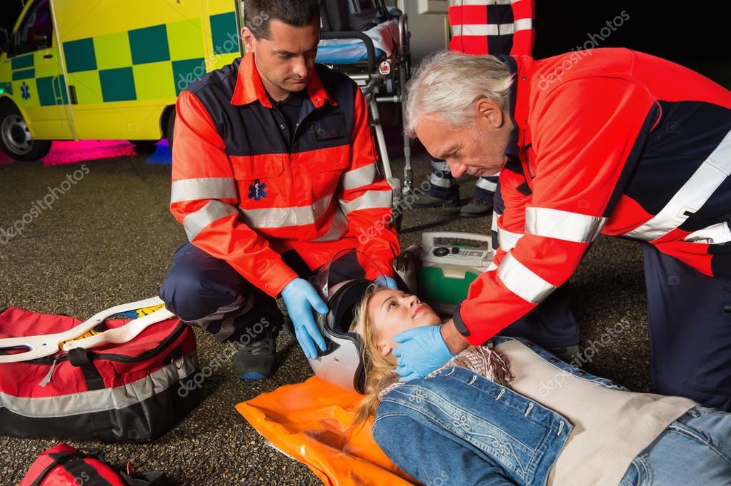 Paramedics removing helmet from driver — Stock Photo © CandyBoxImages ...