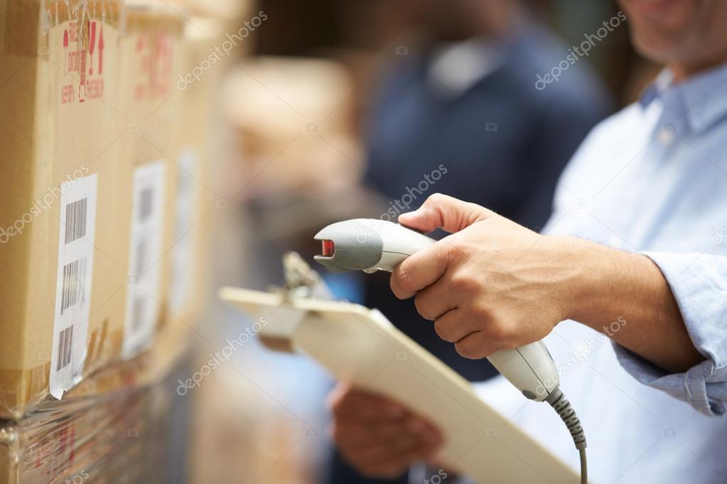 Worker Scanning Package In Warehouse Stock Photo by ©monkeybusiness ...
