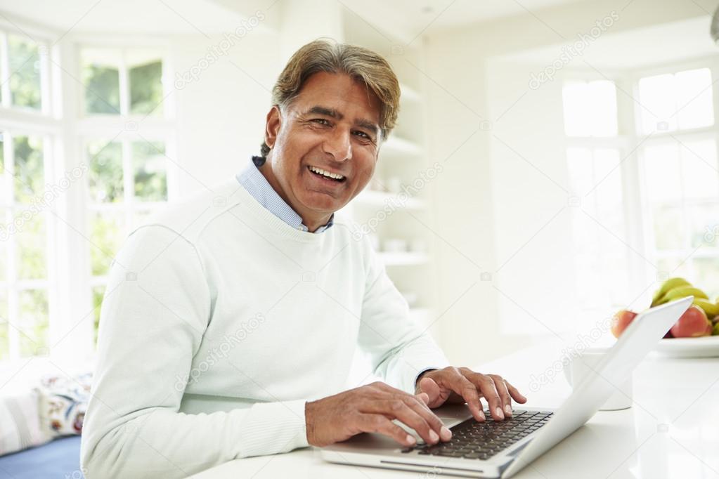 Indian Man Using Laptop Stock Photo by ©monkeybusiness 36972641