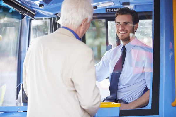 Senior Man Boarding Bus And Buying Ticket - Stock Image - Everypixel