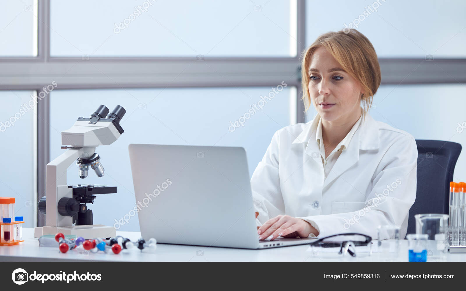 Female Lab Worker Wearing Lab Coat Analysing Blood Samples Laboratory ...