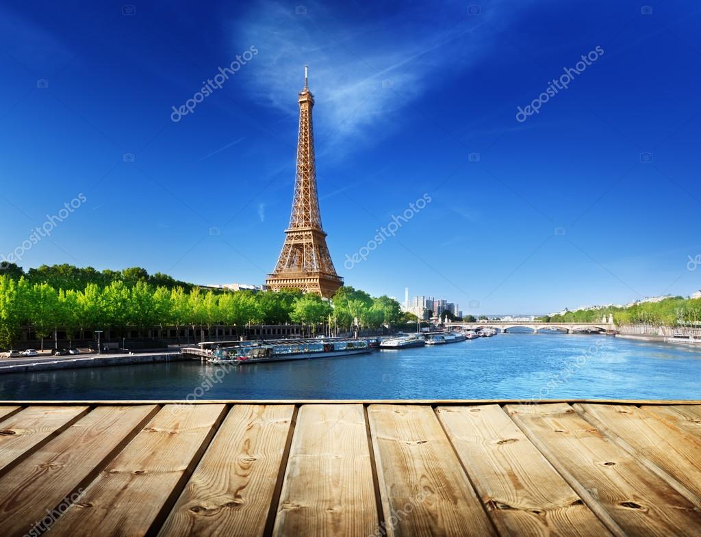 Background with wooden deck table and Eiffel tower in Paris Stock Photo ...