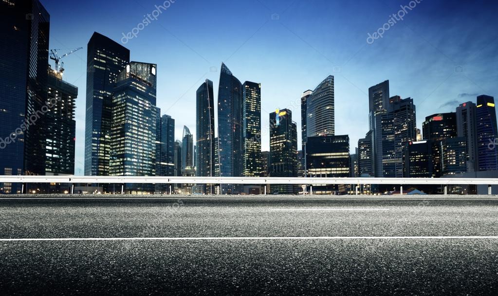 Asphalt road and modern city Stock Photo by ©Iakov 38225887