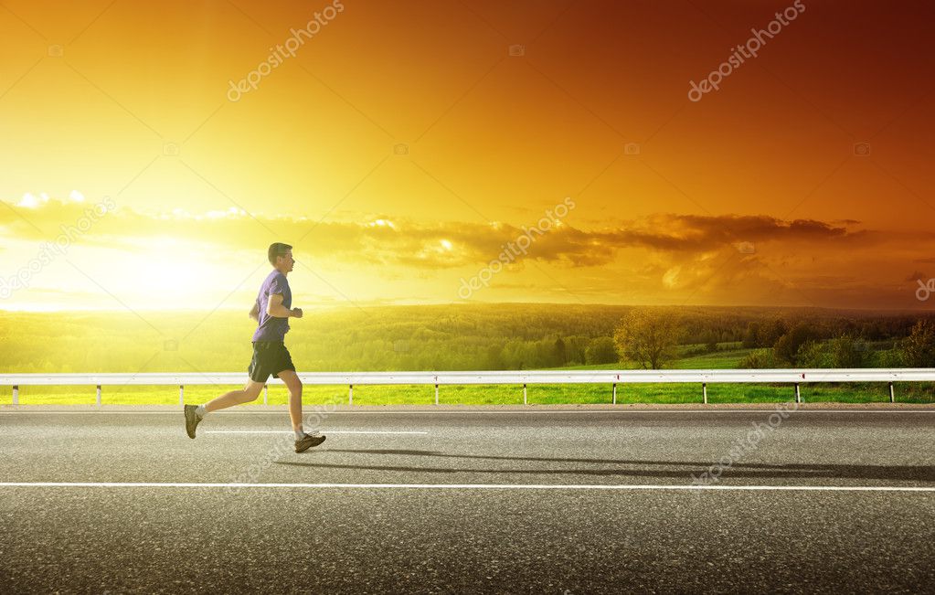 Sunset and running young man — Stock Photo © Iakov #41853173