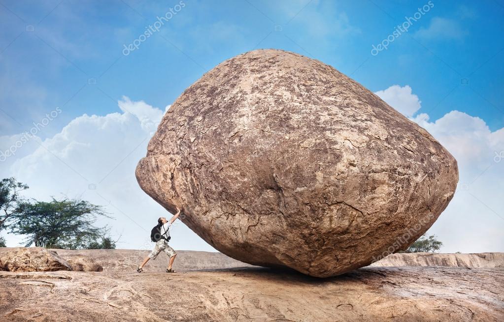 Man pushing a big stone Stock Photo by ©byheaven 35765553