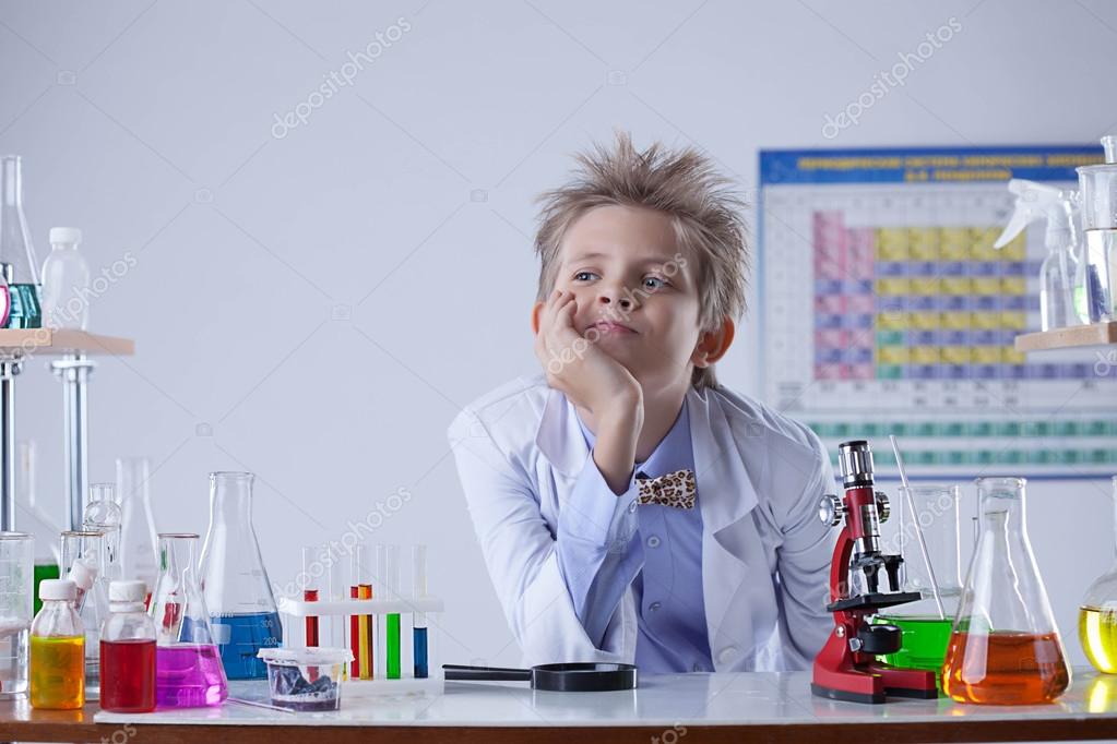 Portrait of young boy posing in laboratory — Stock Photo © Wisky #38425809