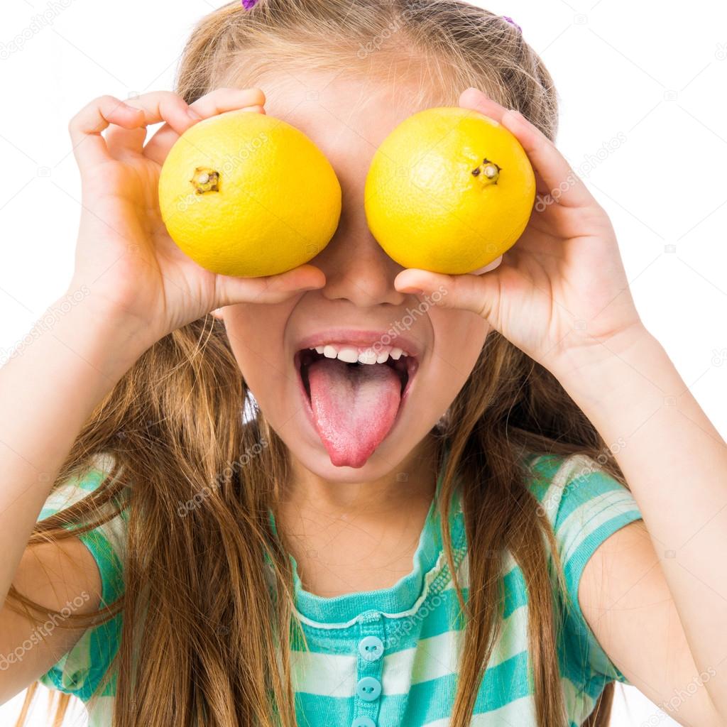 Little girl with lemon Stock Photo by ©GekaSkr 37787117