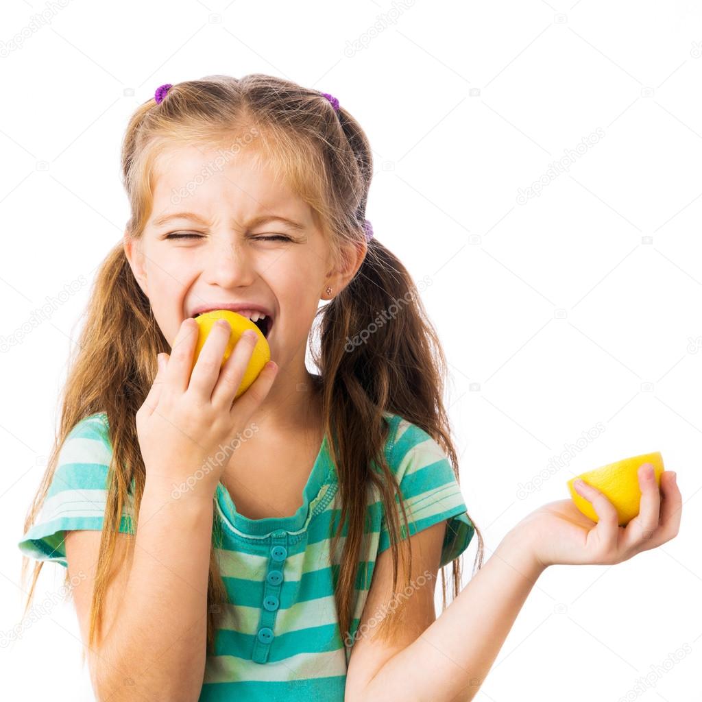 Little girl with lemon Stock Photo by ©GekaSkr 40014547