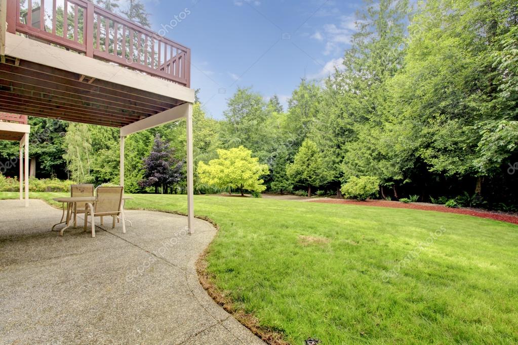 Backyard of the houes with porch and green forest. — Stock Photo ...