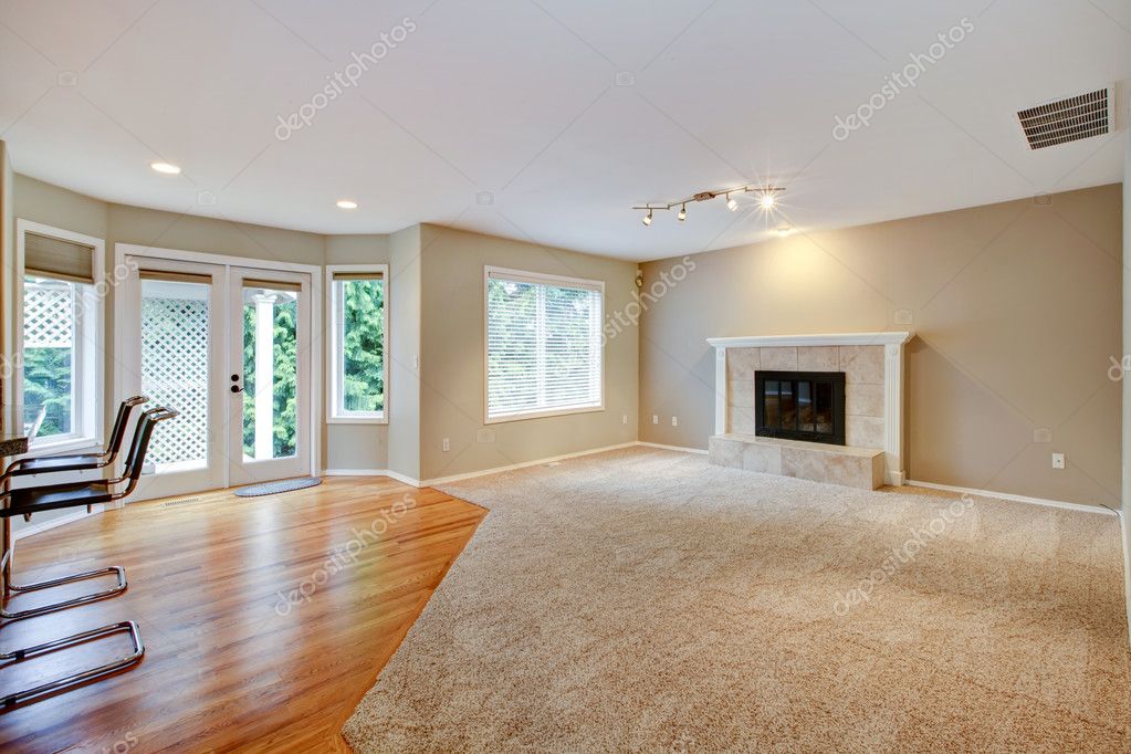 Large bright empty new living room with fireplace. — Stock Photo ...
