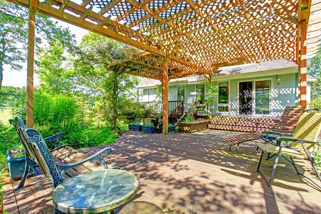 Backyard farm deck with attached open pergola — Stock Photo © iriana88w ...