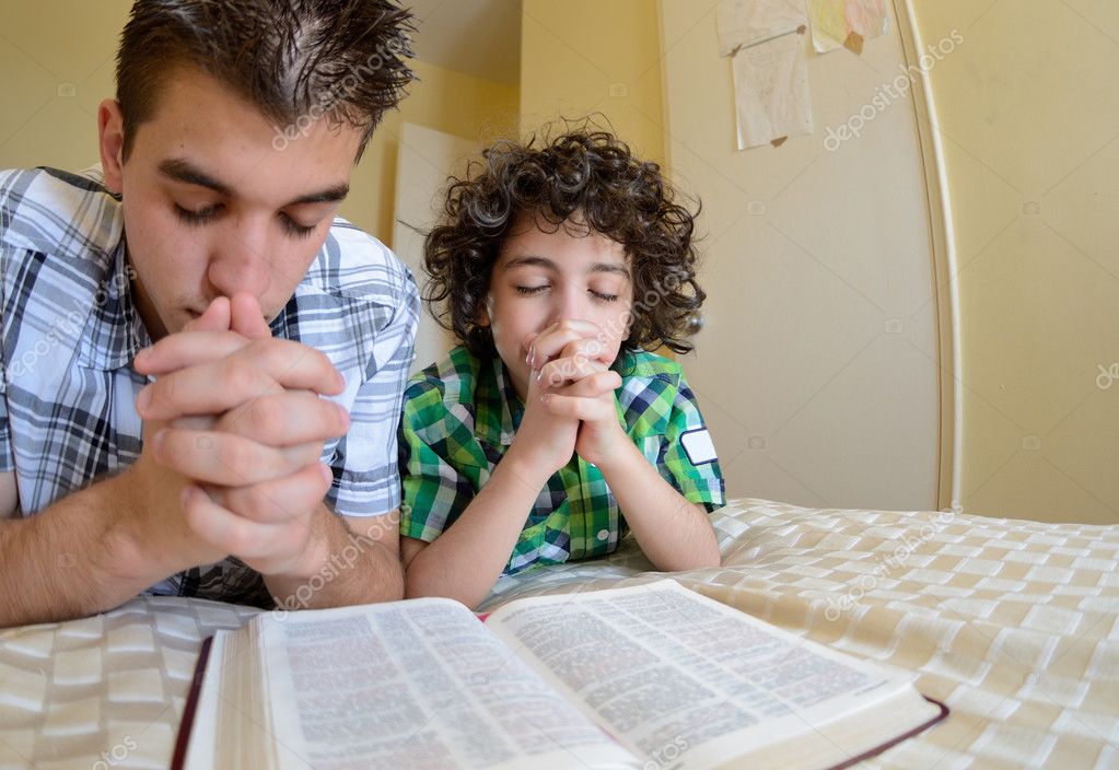 Young Family Praying — Stock Photo © yelo34 #22919710