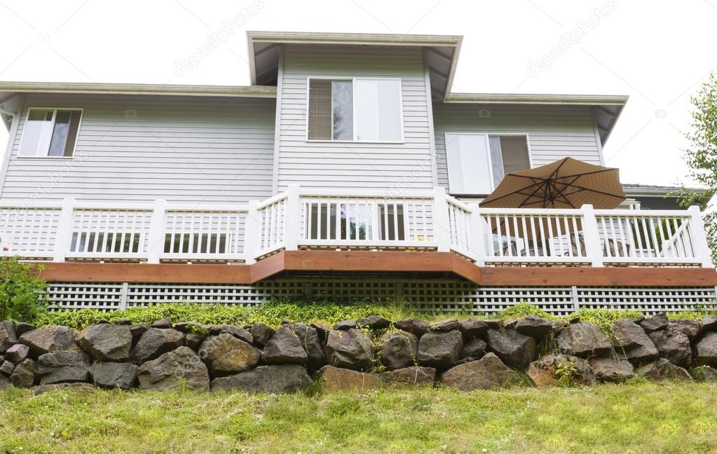 Backside of Modern Home with Large Wooden Deck — Stock Photo © tab62 ...
