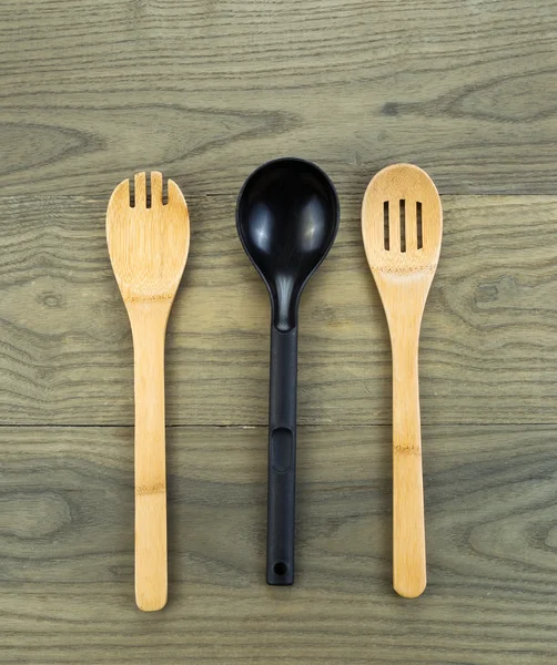 Three kitchen spoons on aged white oak wood - Stock Image - Everypixel