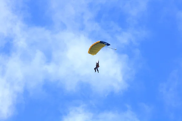 Skydiver parachuting down to the Earth. - Stock Image - Everypixel