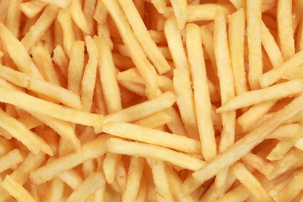 Closeup of french fries texture Stock Photo by ©NeydtStock 142211898