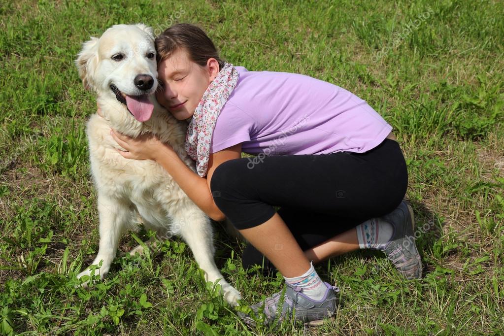 Child caressing her pet dog Stock Photo by ©Boarding2Now 34743839