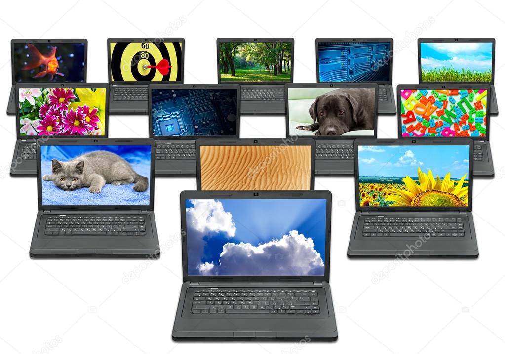 Many laptops with different pictures on the screen — Stock Photo ...
