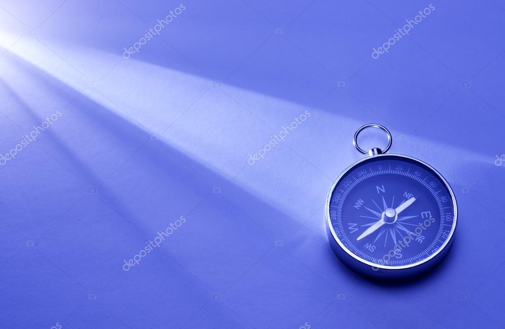 Compass in a beam of light Stock Photo by ©serggn 32071891