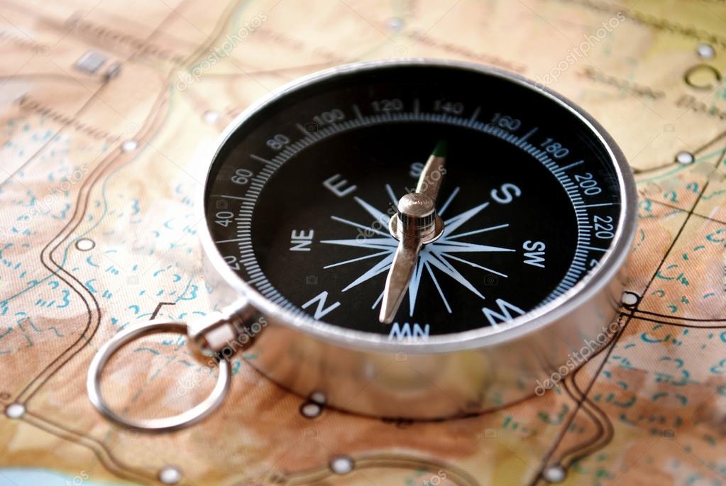 Handheld compass on a map — Stock Photo © serggn #37268107