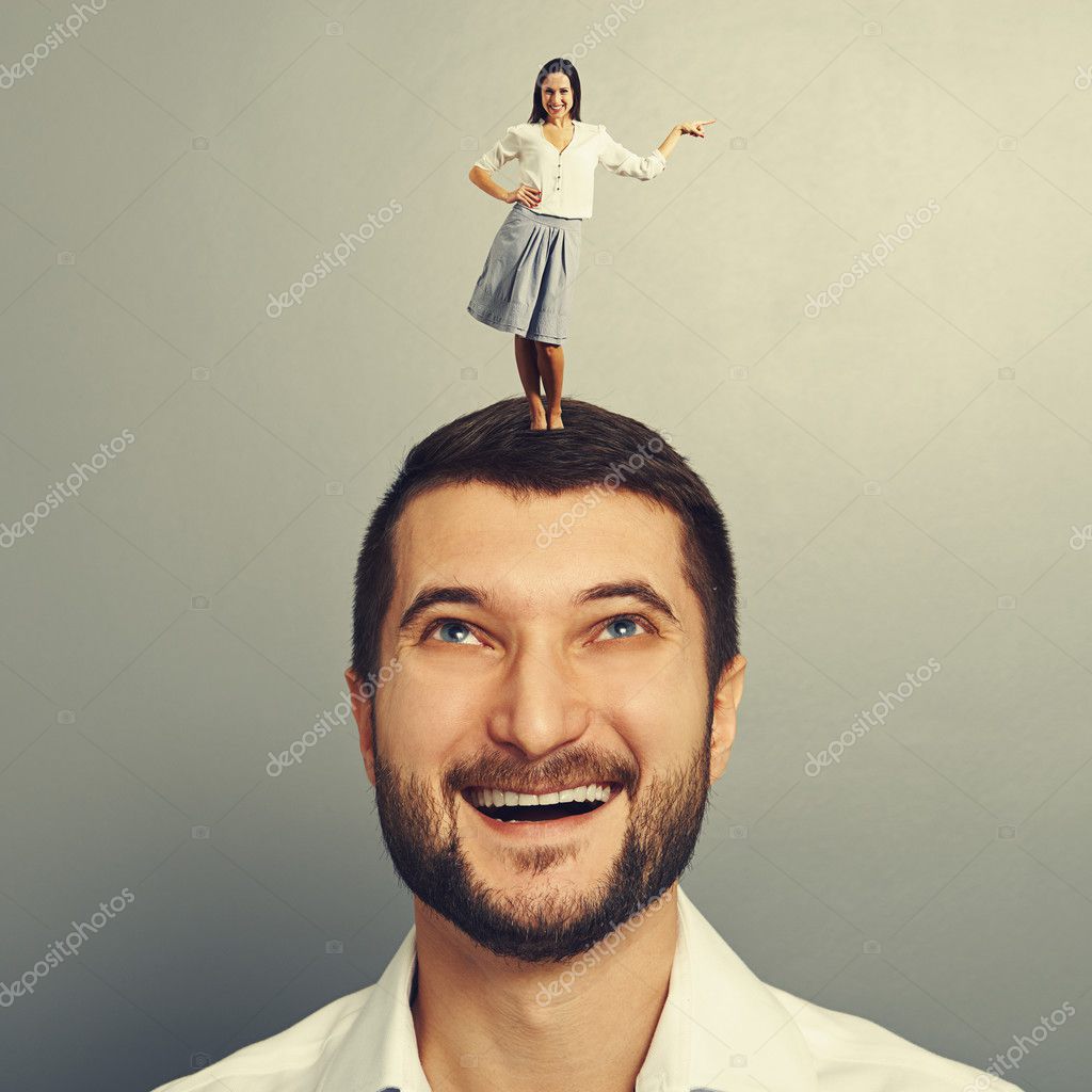 Woman standing on the smiley man — Stock Photo © konstantynov #42749685