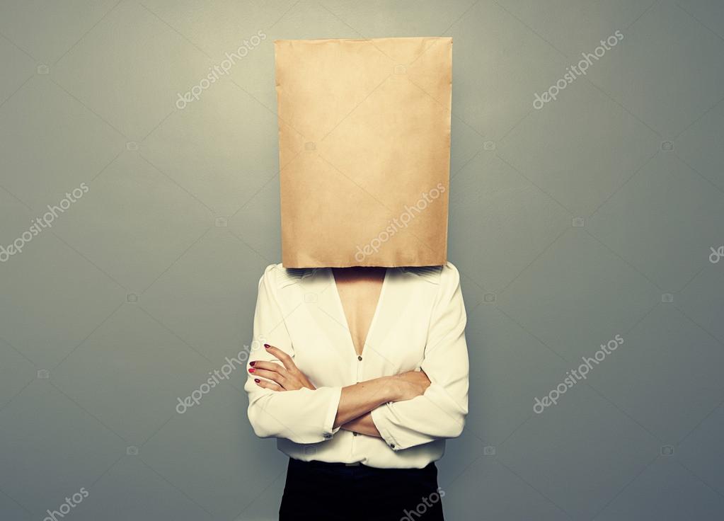 Woman hiding under empty paper bag Stock Photo by ©konstantynov 46671319