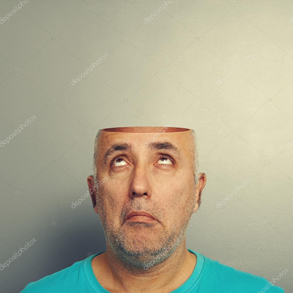 Senior man looking up at open head ⬇ Stock Photo, Image by ...