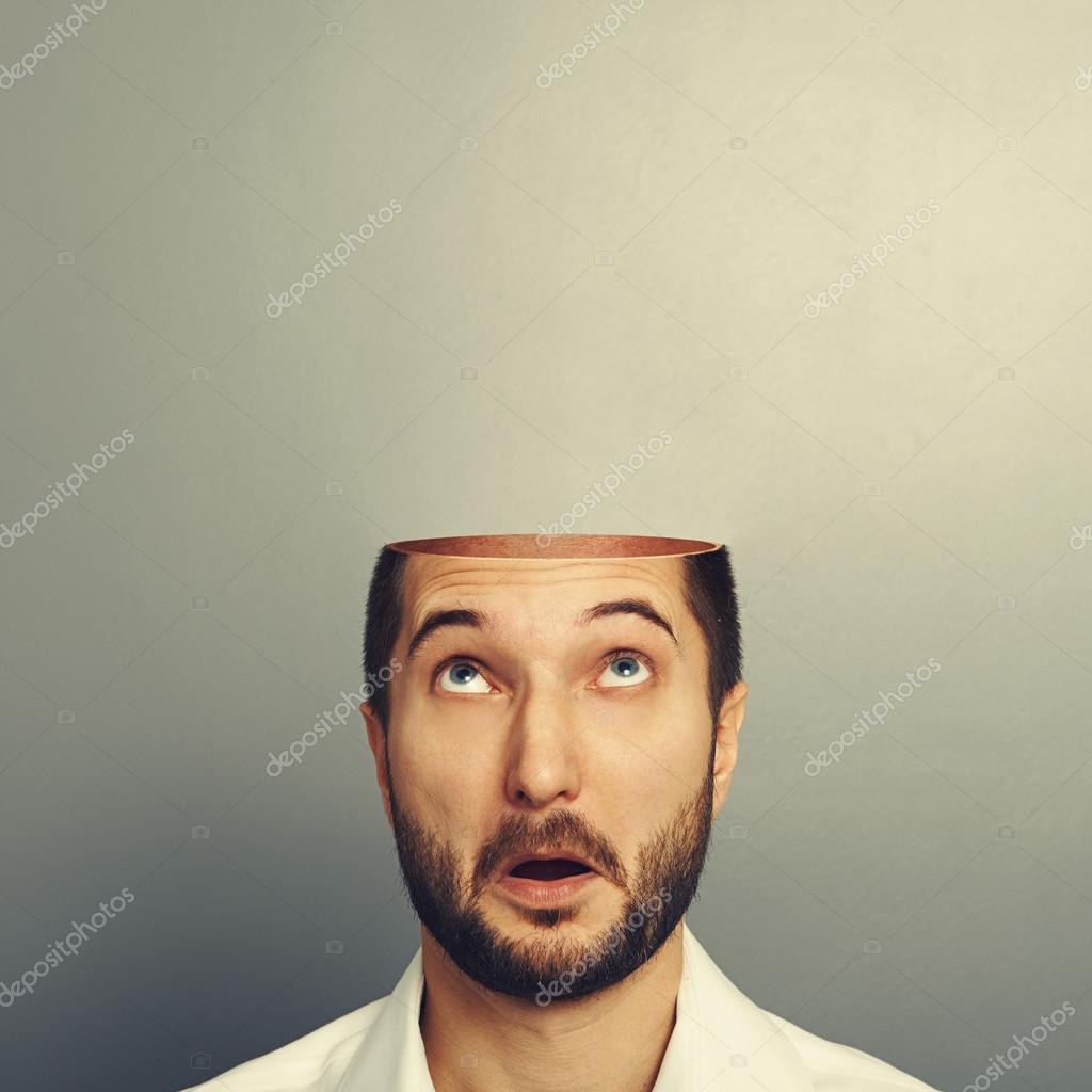 Surprised man looking up at his open empty head — Stock Photo ...